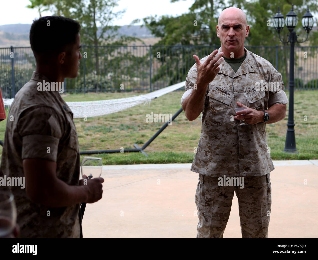 U.S. Marine Brig. Gen. David A. Ottignon speaks with meritoriously ...