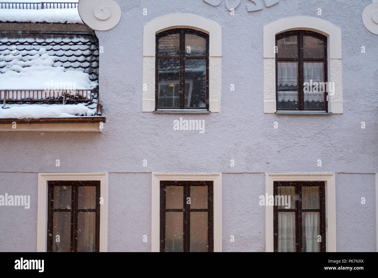 Snow falling with windows, building on the background Stock Photo - Alamy