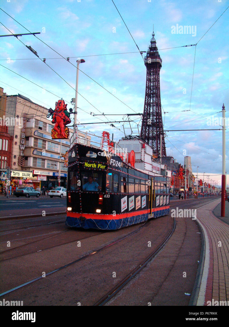 One of Blackpool's famous heritage trams traverses the promenade with ...