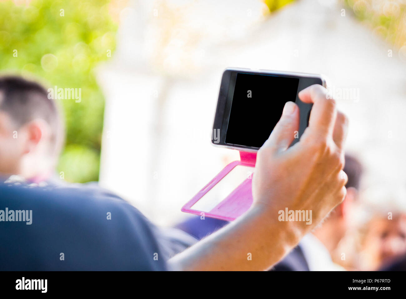 Hands using a smart phone in outdoor Stock Photo - Alamy