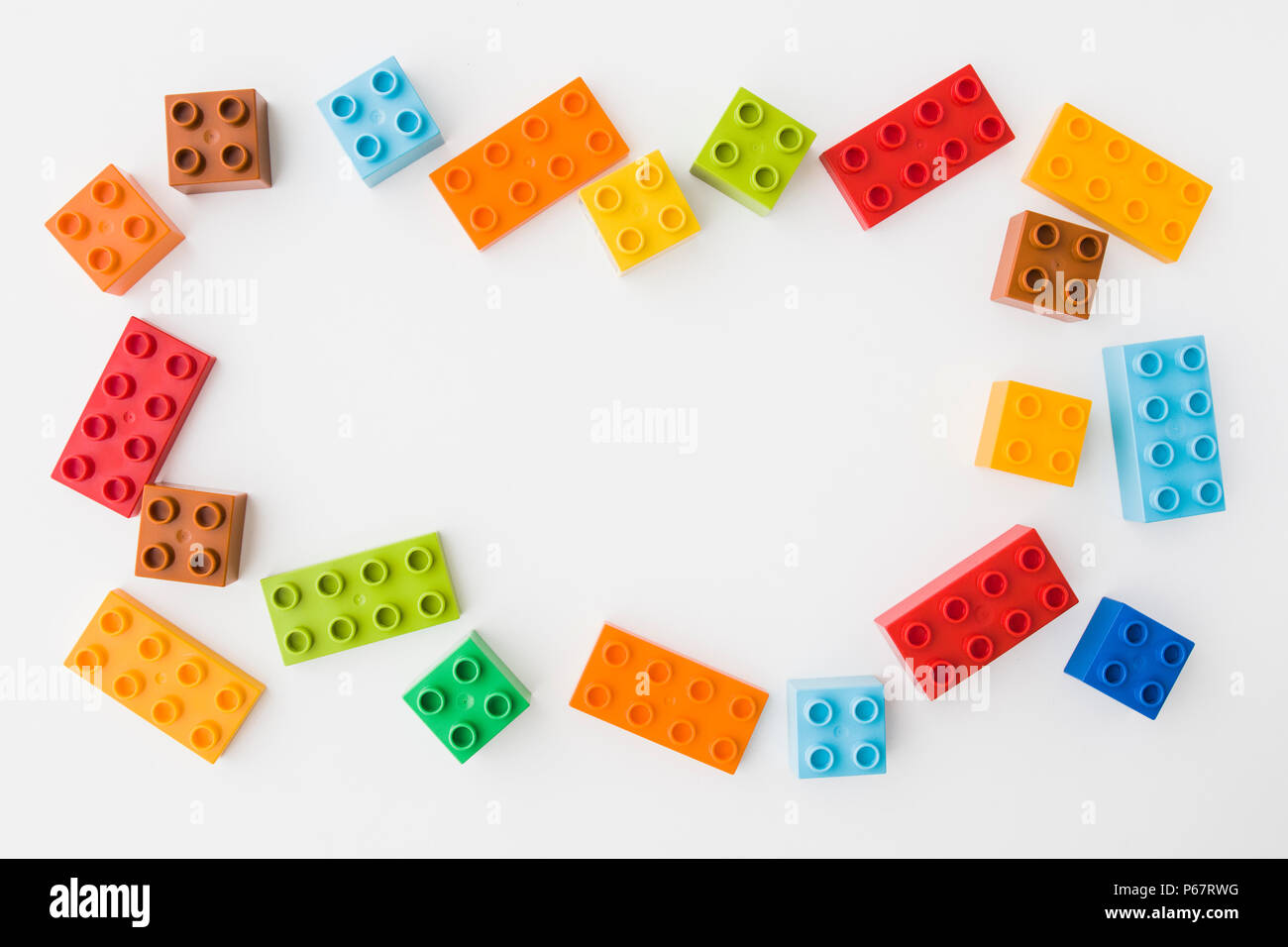 toy bricks of assorted colors on white background Stock Photo - Alamy