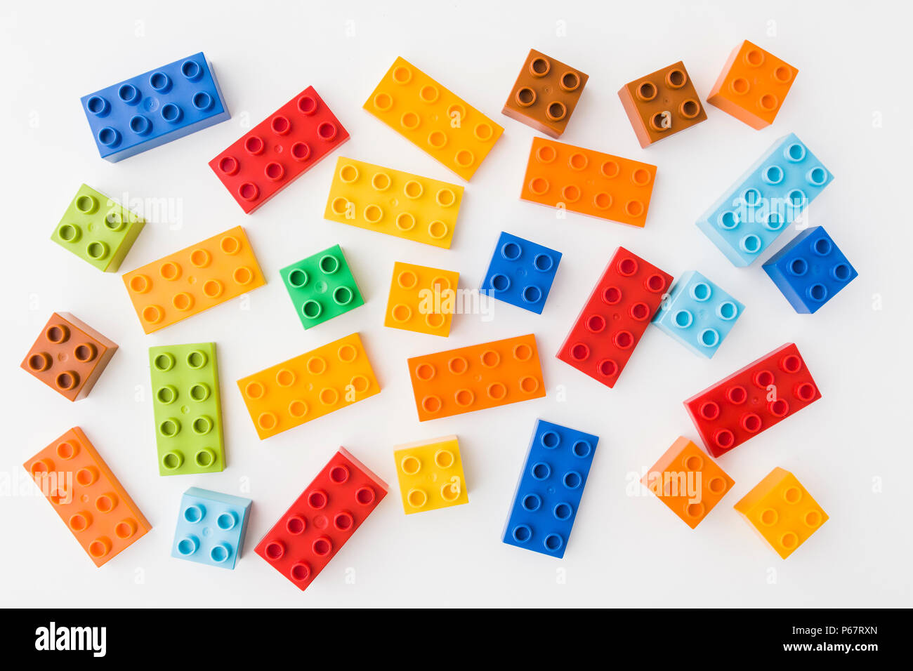 toy bricks of assorted colors on white background Stock Photo - Alamy