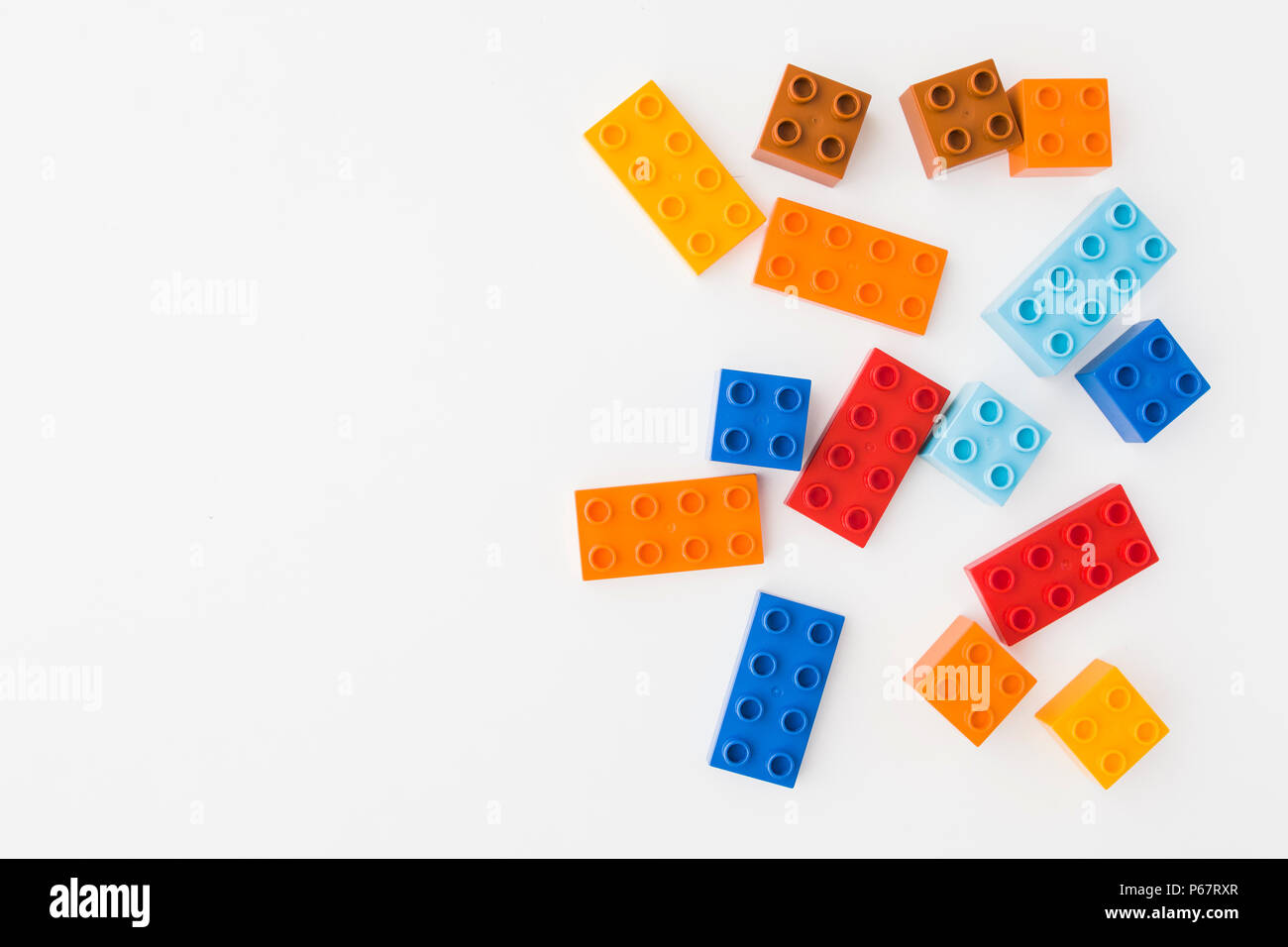 toy bricks of assorted colors on white background Stock Photo - Alamy