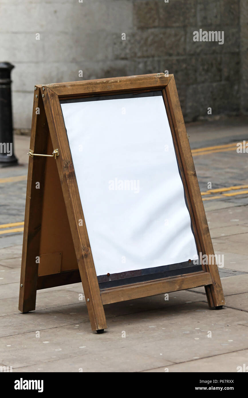 Commercial empty wooden A board on street sidewalk Stock Photo - Alamy