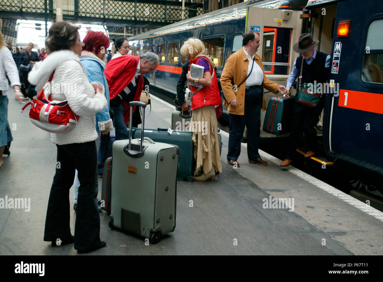Passengers leaving the train on arrival at London's Kings Cross station ...