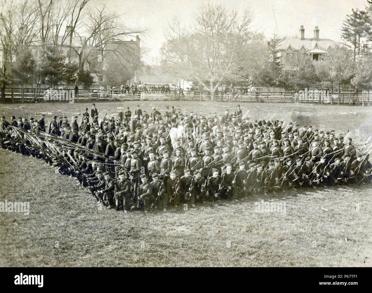 Photograph of Canadian soldiers of the Queen's Own Rifles pose in square formation, Toronto ...