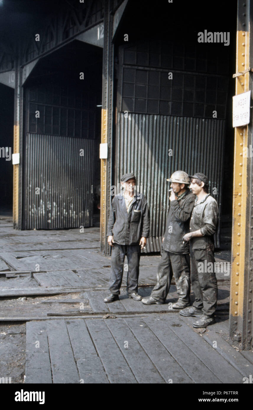 Steam locomotive fitters engaged in conversation at Klodzko motive ...