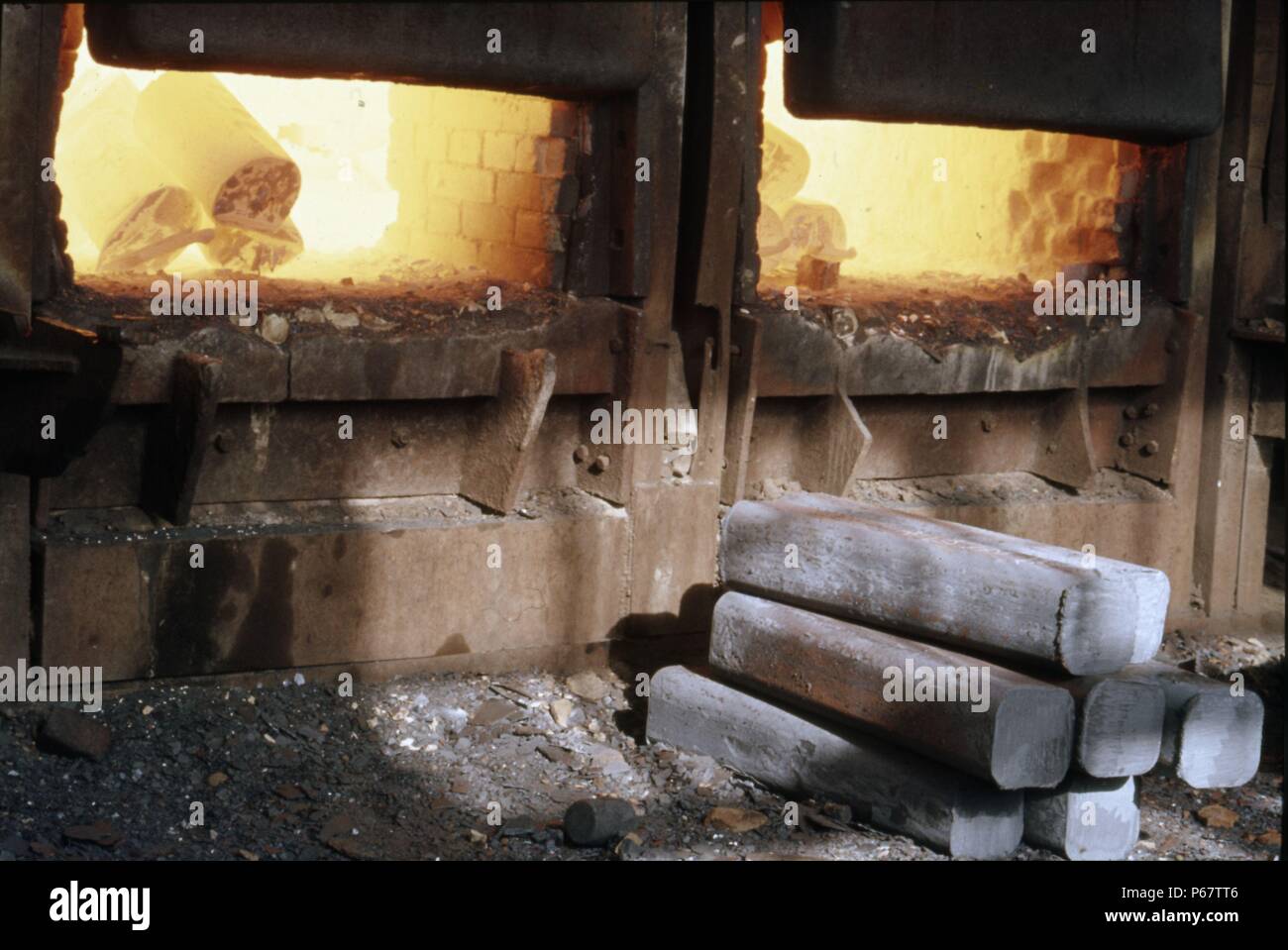 Steel ingots being heated in the furnace for the forging of detail ...