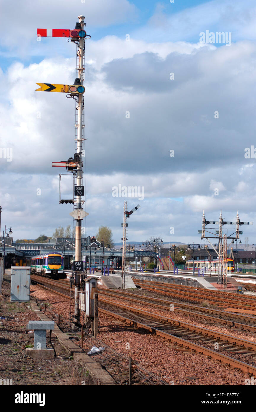 Surrounded by traditional semaphore signalling a Class 170/4 Turbostar ...