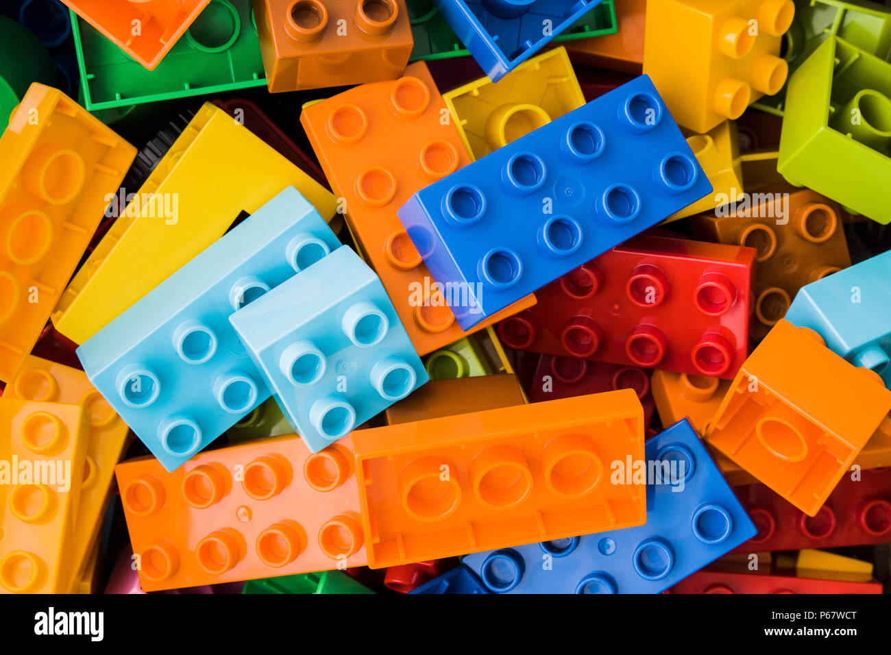 toy bricks of assorted colors on white background Stock Photo - Alamy