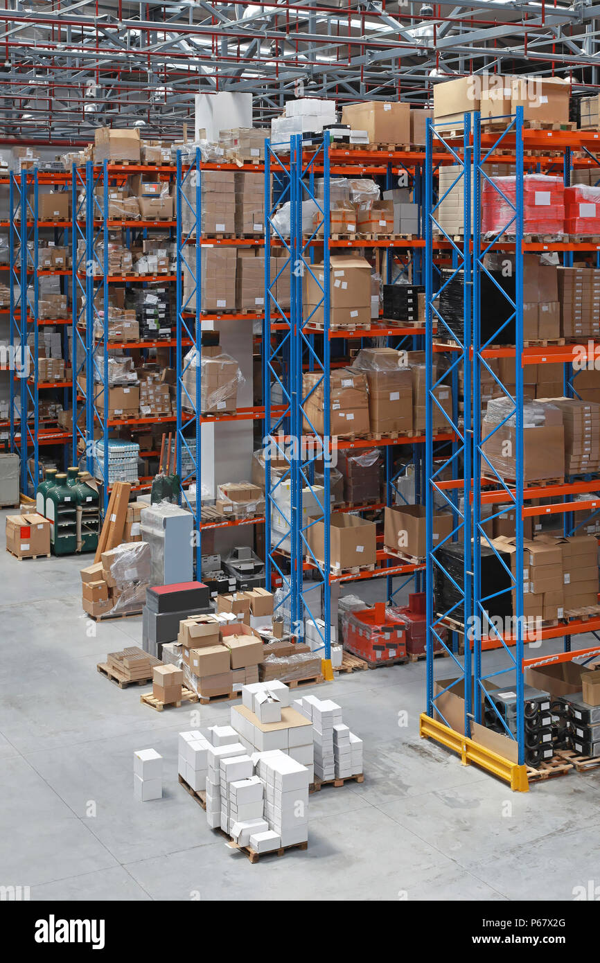 Distribution warehouse with high rack shelving system Stock Photo - Alamy