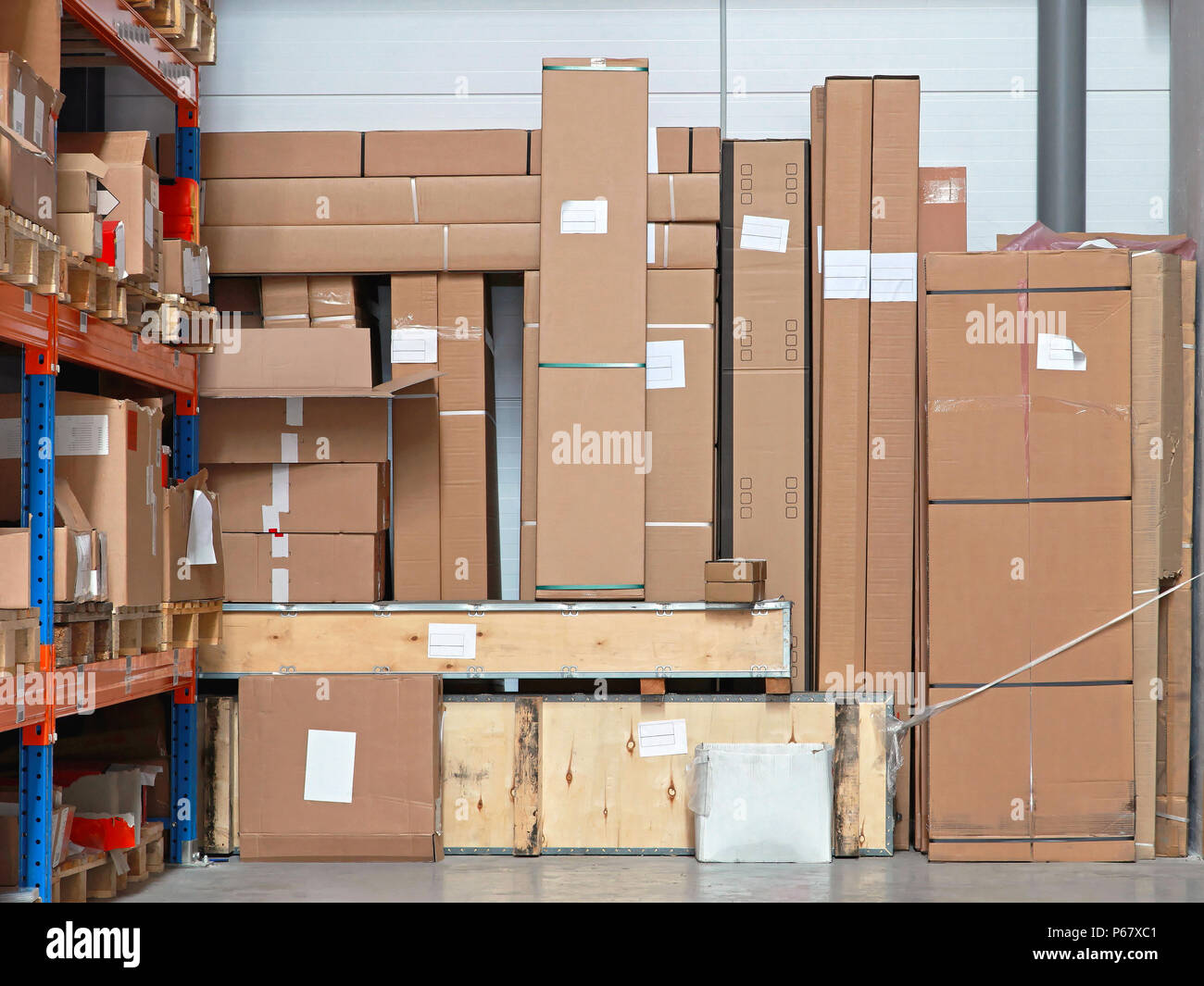 Cardboard boxes with equipment in distribution warehouse Stock Photo ...