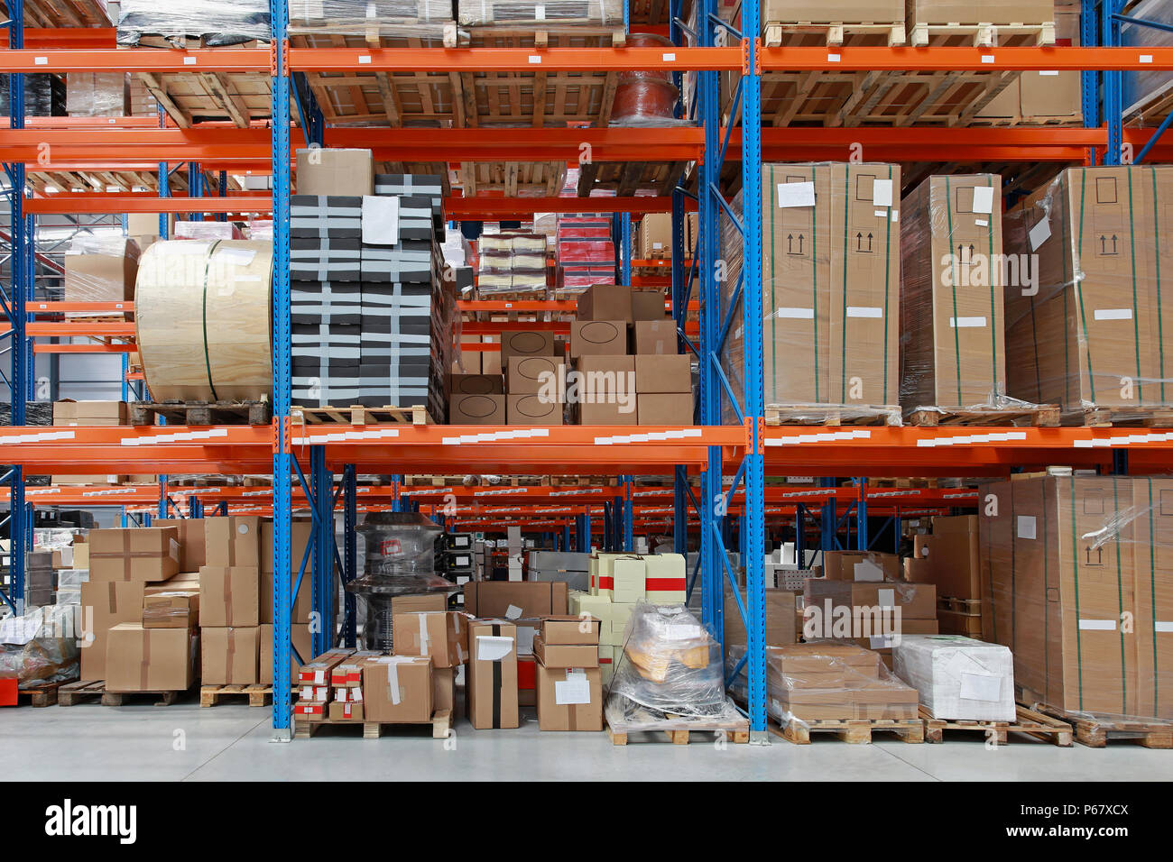 Shelving system with goods in distribution warehouse Stock Photo - Alamy