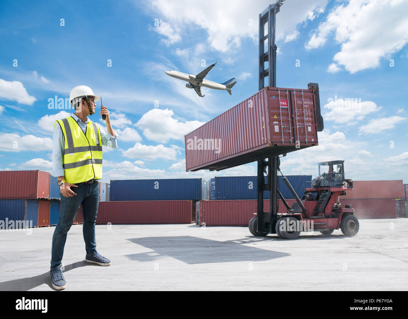 Foreman control loading containers box from cargo freight ship for ...