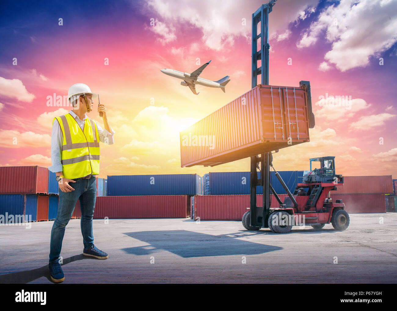 Foreman control loading containers box from cargo freight ship for ...