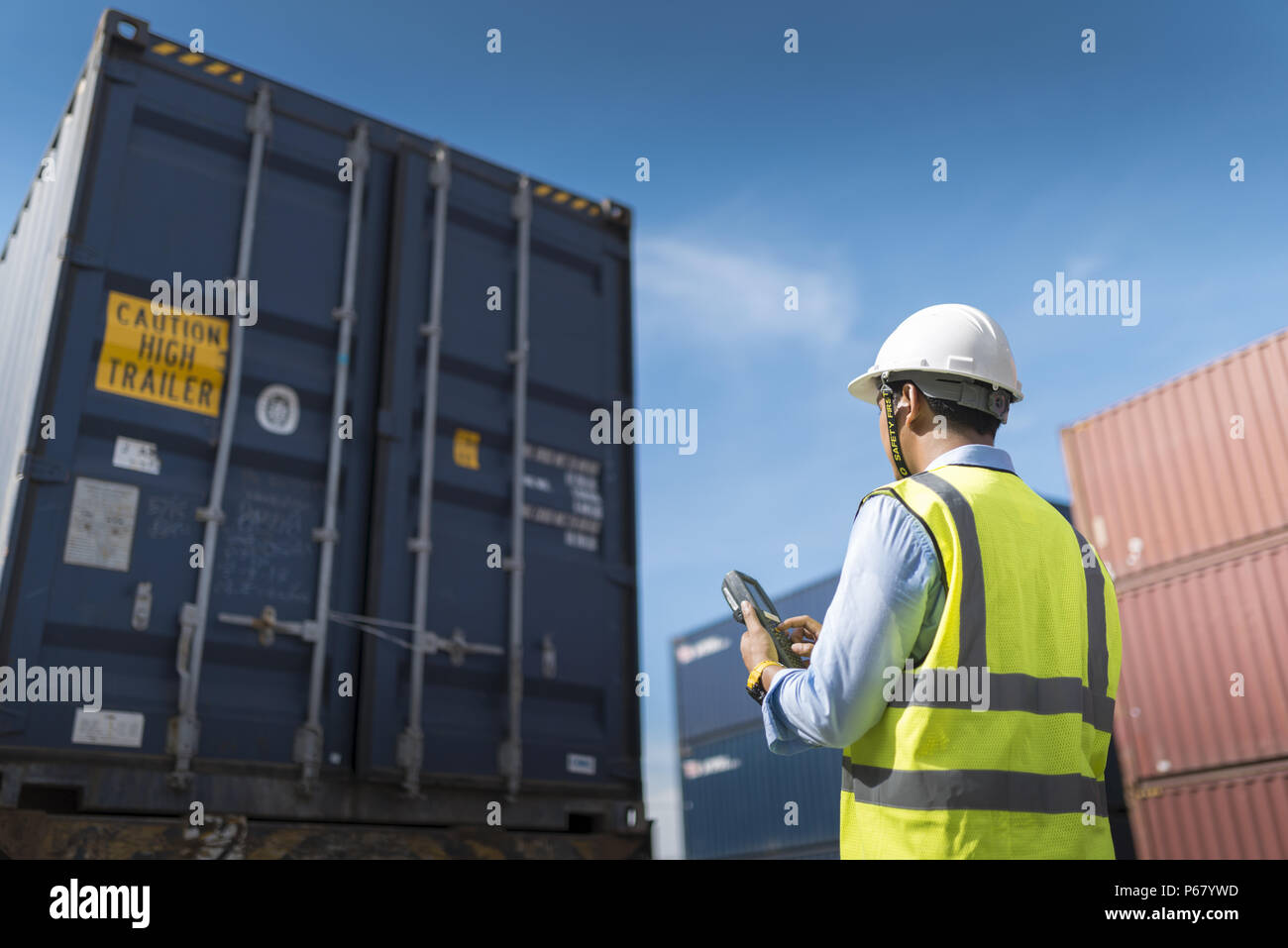 Foreman control loading containers box from cargo freight ship for ...