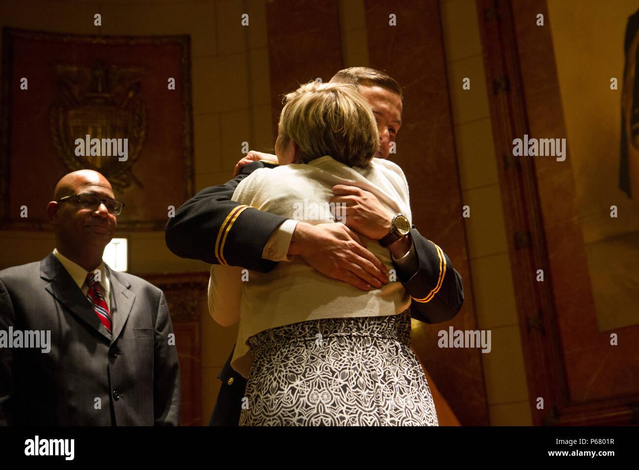 2nd Lt. Nicholas Ryan hugs his mother while celebrating his promotion ...
