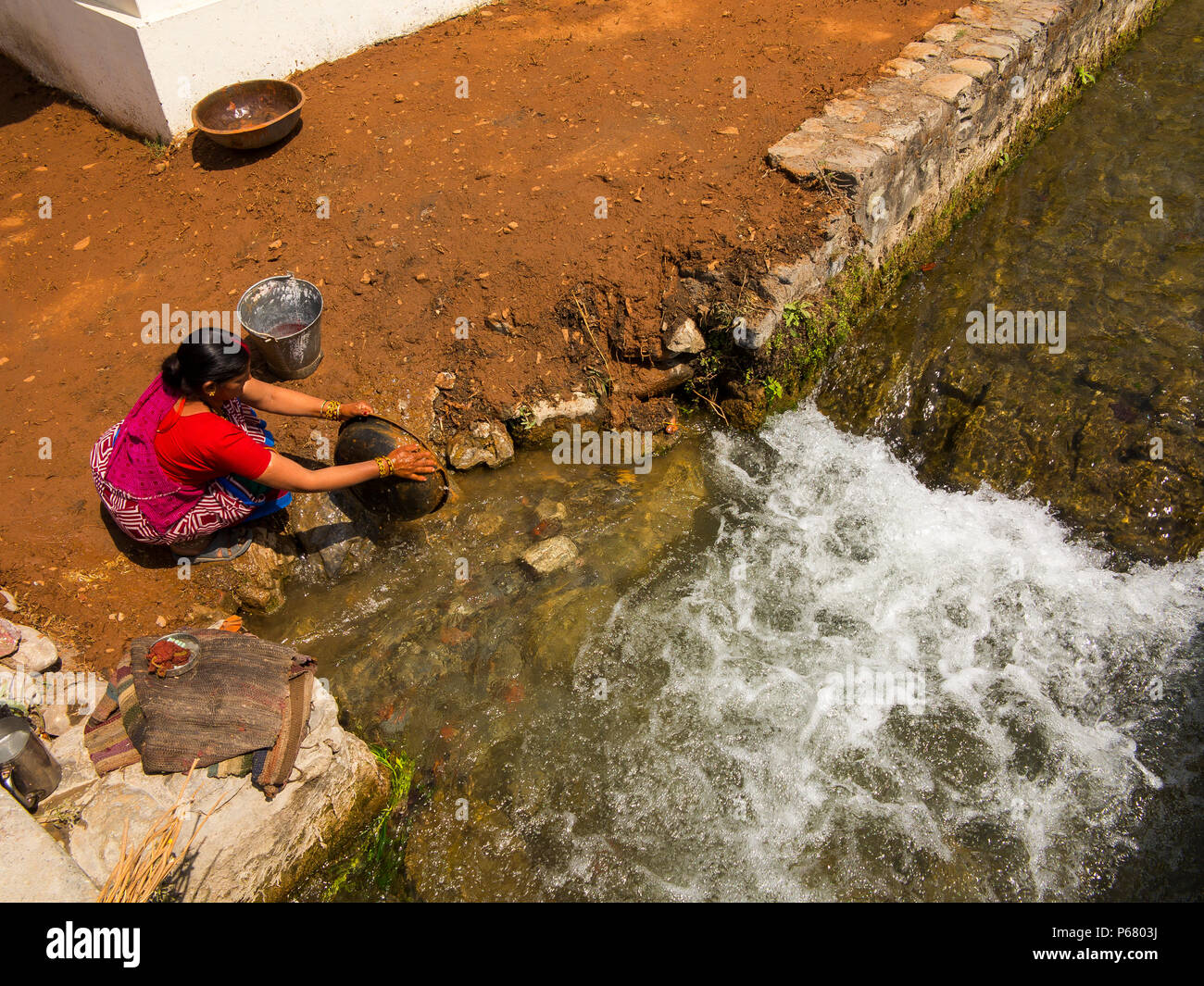 Indian woman washing clothes hi-res stock photography and images - Alamy
