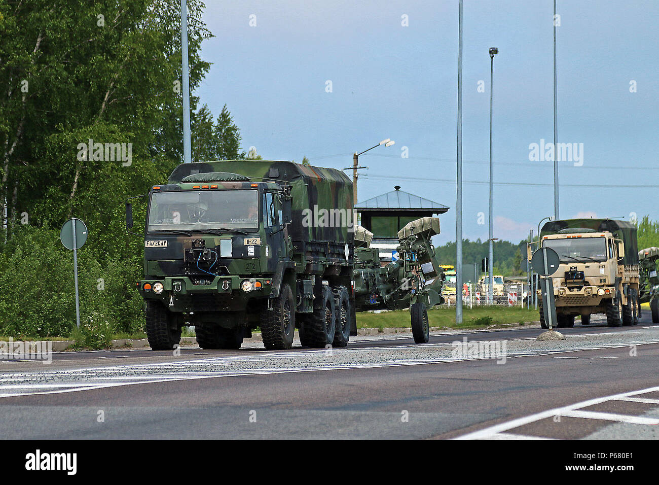 Travelling along the Baltic Sea coastline, a convoy of vehicles ...