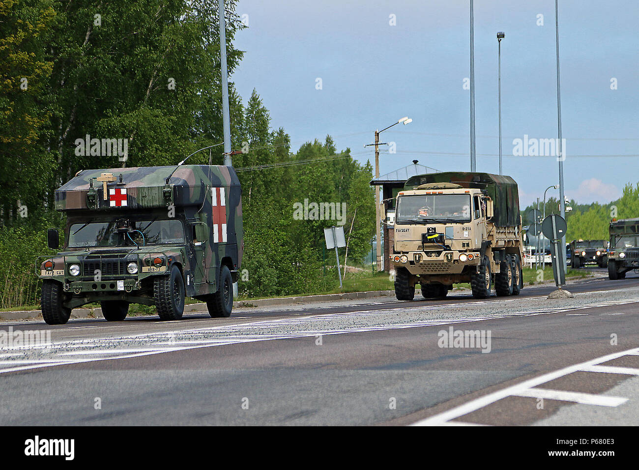 Travelling along the Baltic Sea coastline, a convoy of vehicles ...