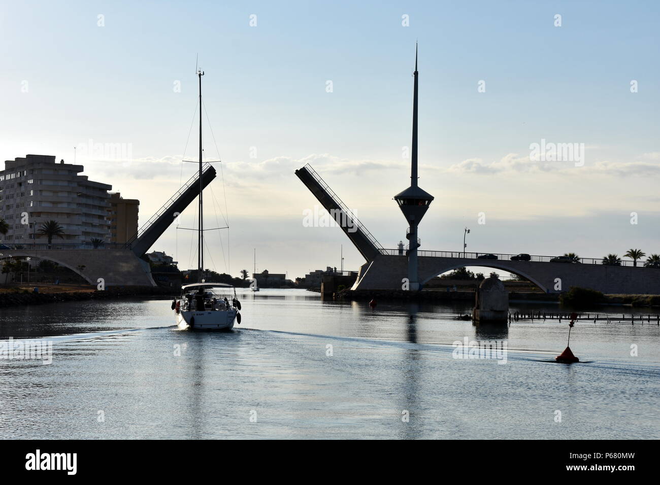Boat approaching the Estacio lifting bridge which crosses the main ...