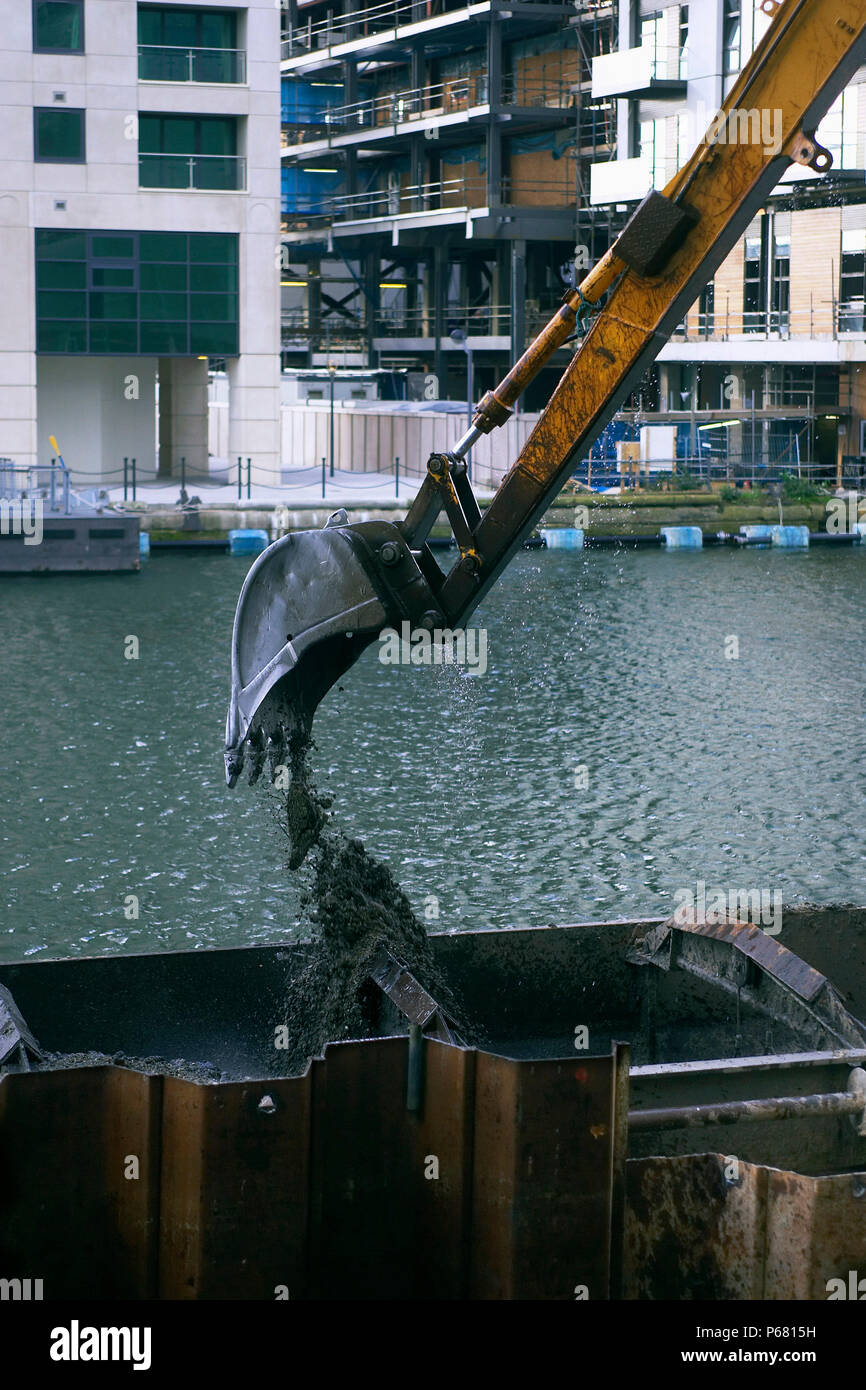 Excavator bucket during dredging excavations Stock Photo - Alamy