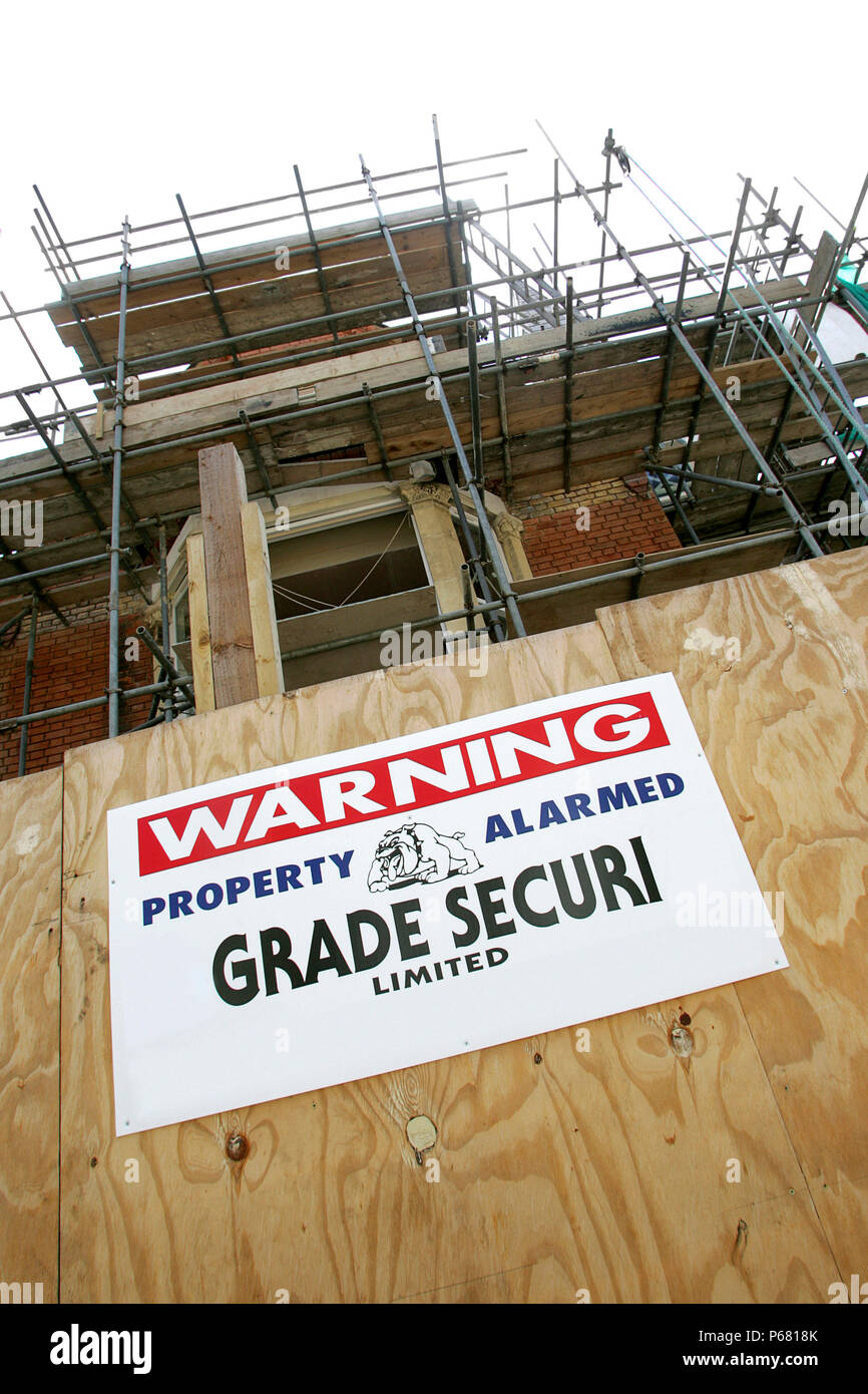 Security signs on a hoarding Stock Photo - Alamy