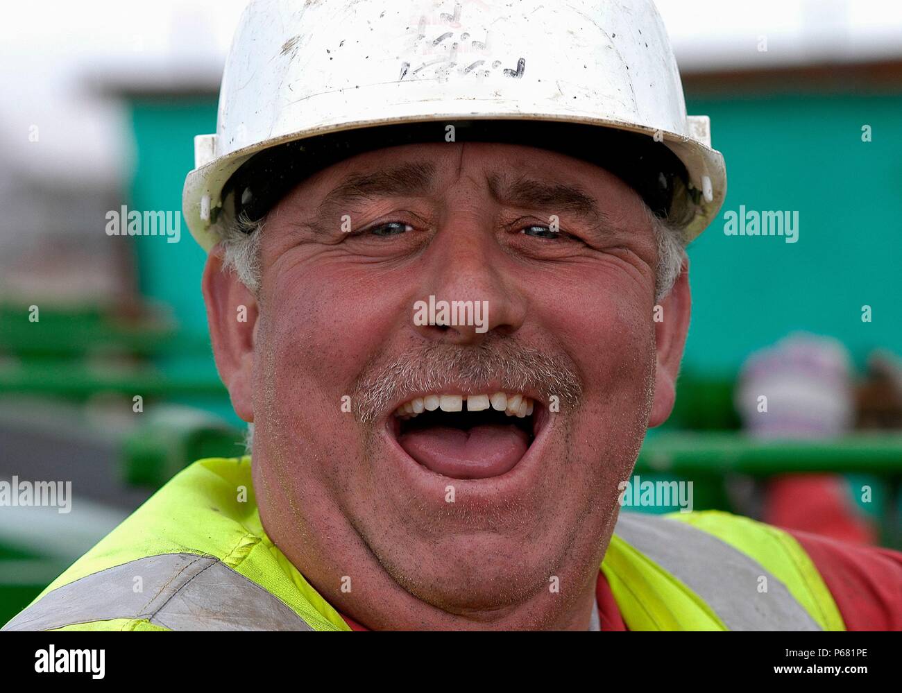 "Construction worker laughing, Terminal 5, Heathrow Airport ...