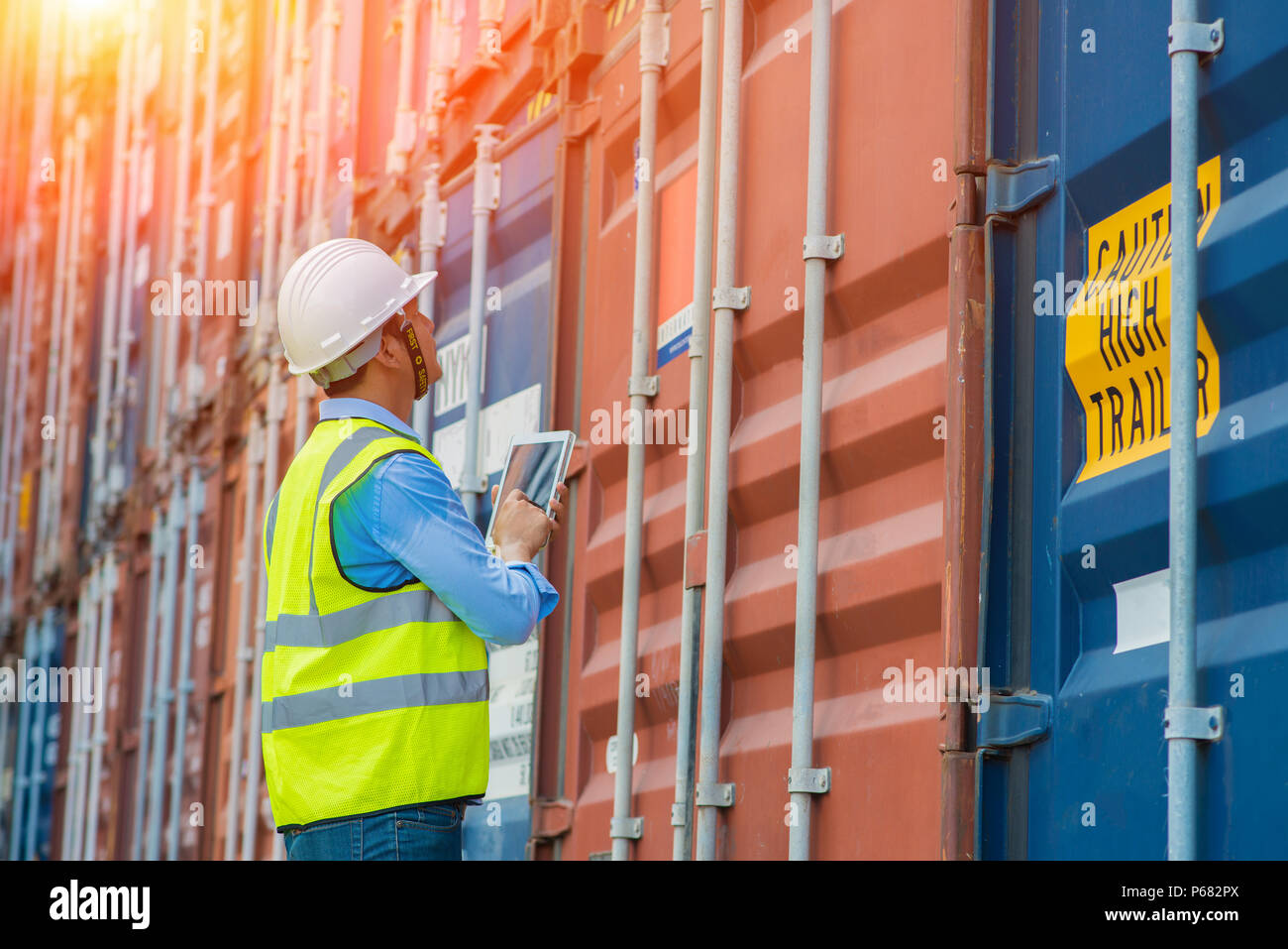 Foreman control loading containers box from cargo freight ship for ...