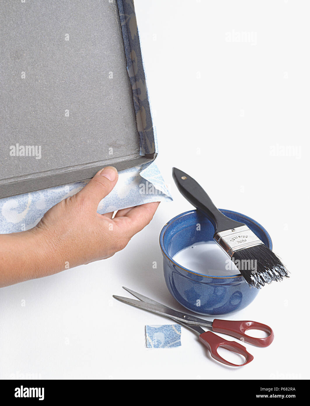 Covering a cardboard storage box Stock Photo - Alamy