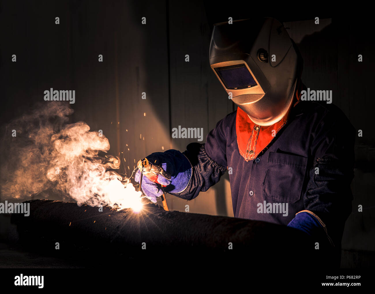 Industrial Worker at the factory welding closeup Stock Photo - Alamy