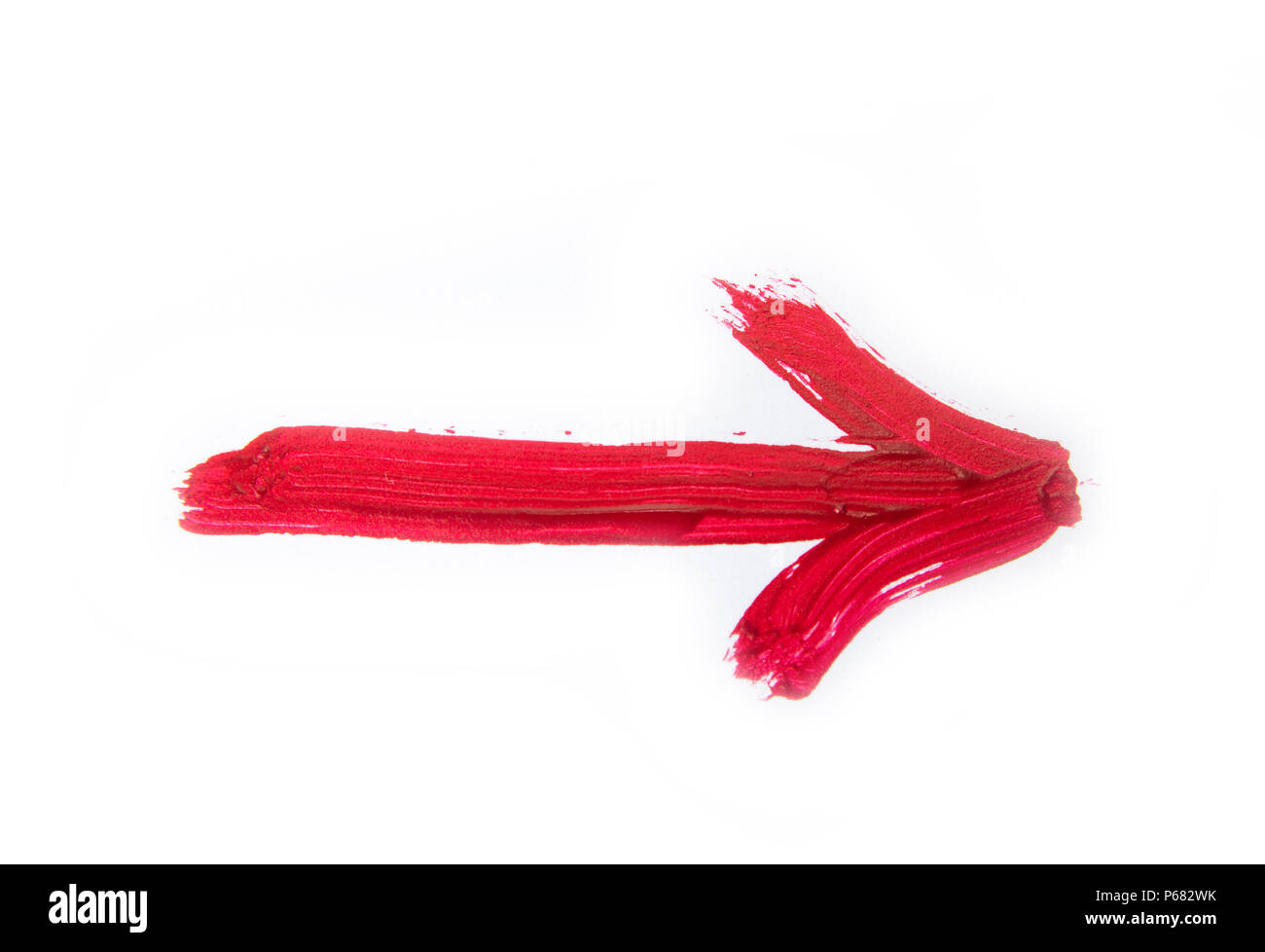 Red hand painted arrow with brush strokes isolated on the white ...