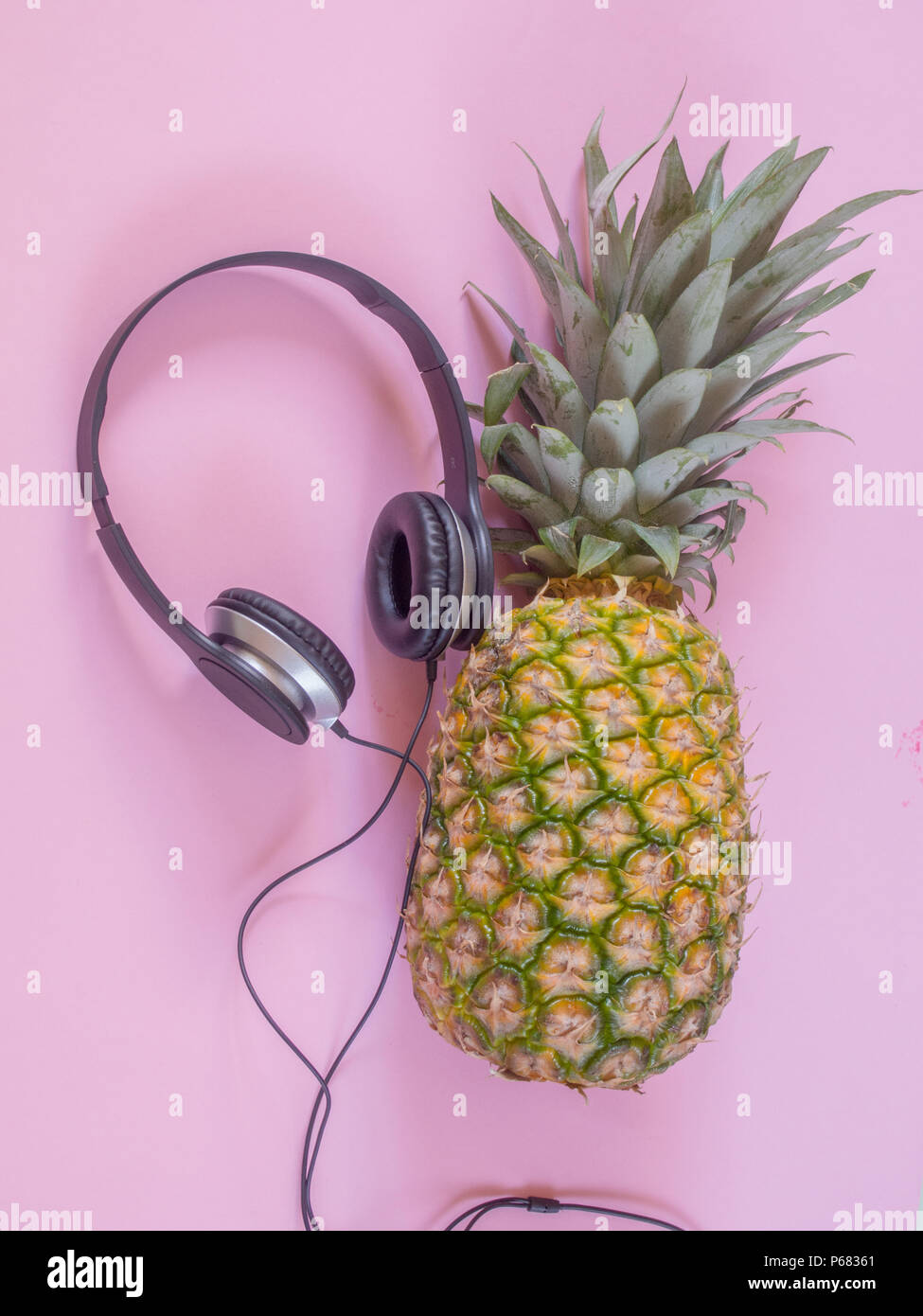 Pineapple and earphones on pink background - summer music concept Stock ...