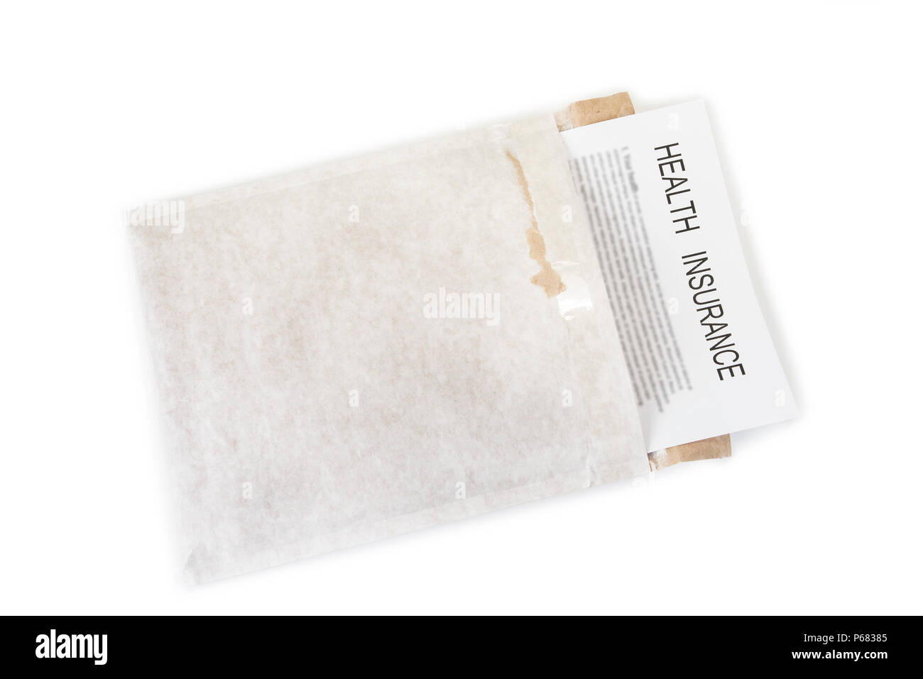 Health insurance in the envelope on the white Stock Photo - Alamy