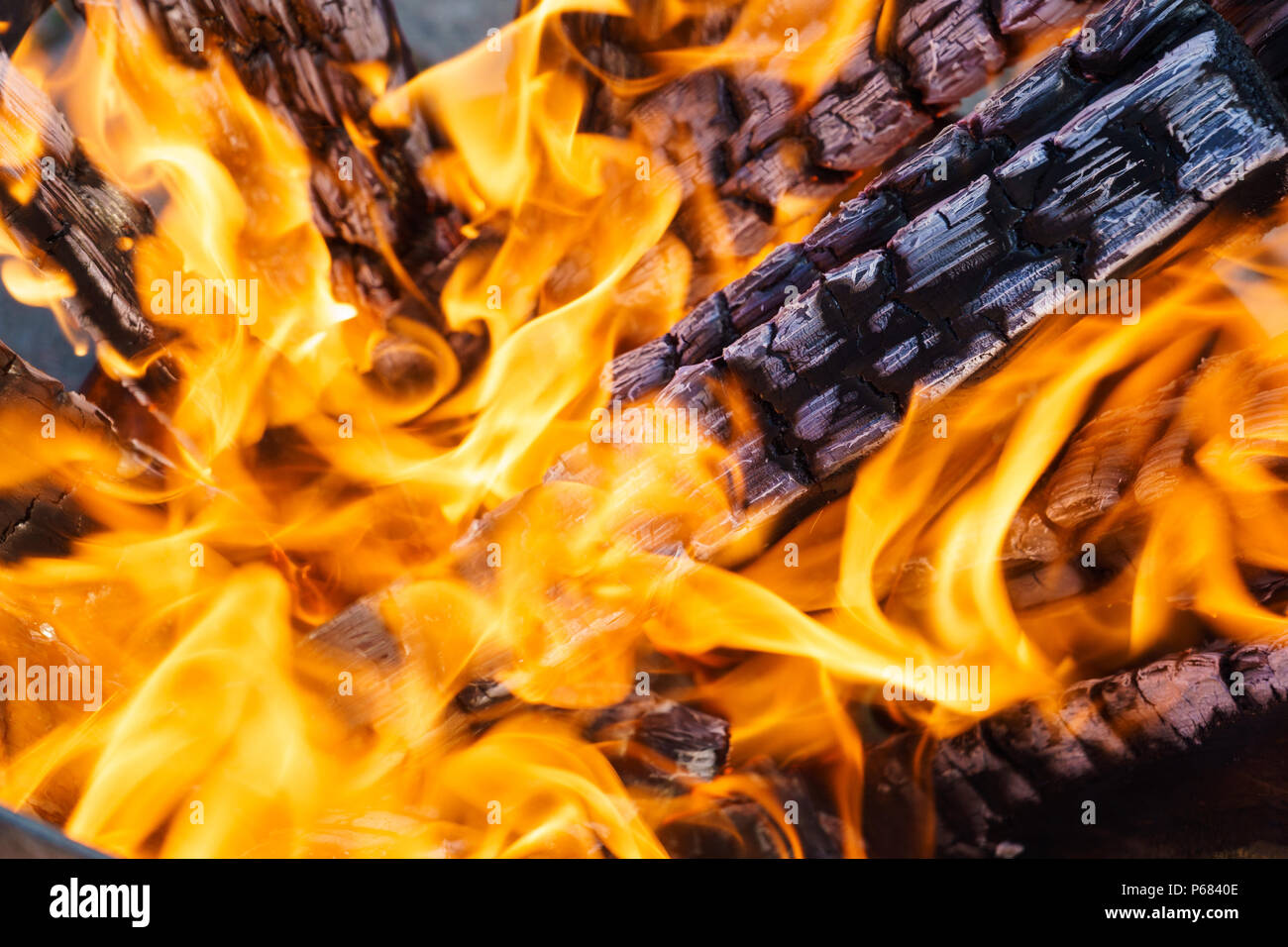 crest of flame on burning wood in fireplace Stock Photo - Alamy