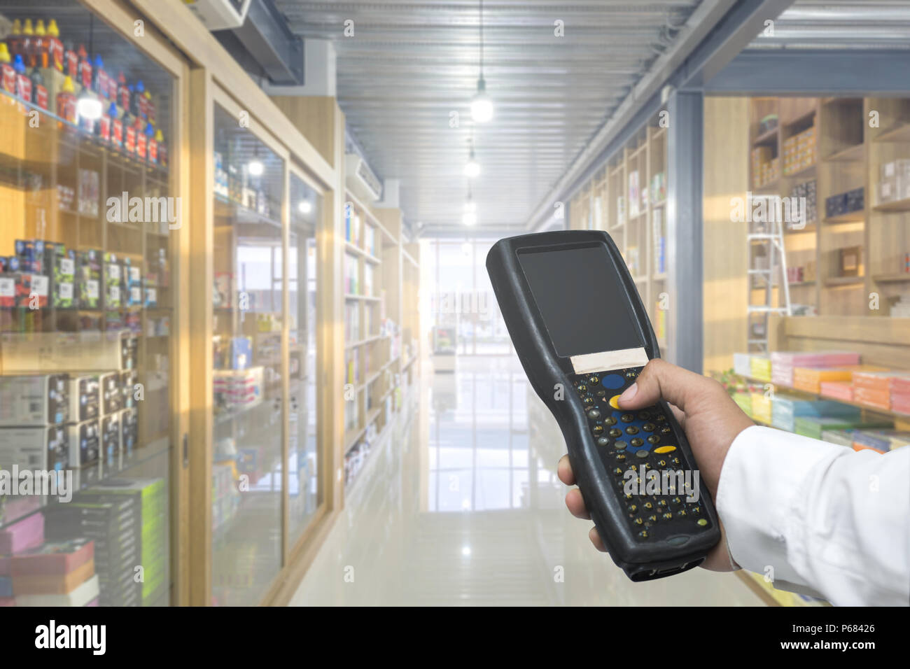 Worker checking and scanning package by tablet handheld in warehouse ...