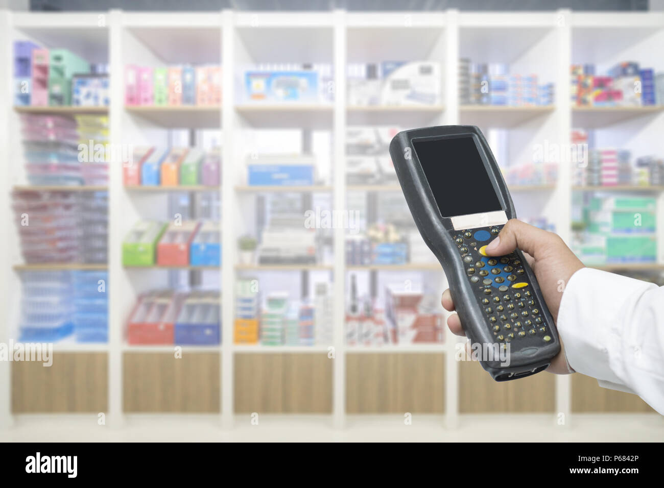 Worker checking and scanning package by tablet handheld in warehouse ...