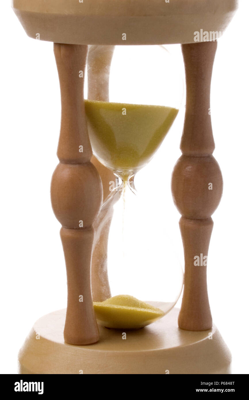 sand clock showing how is time passing on white background Stock Photo ...