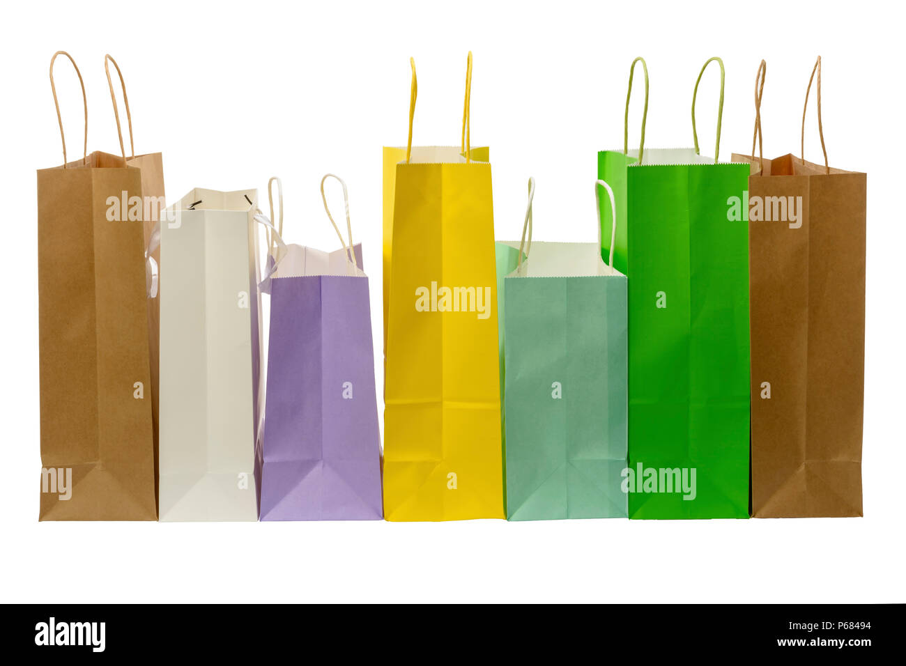 Variety of colored paper shopping bags on white background. Empty area ...