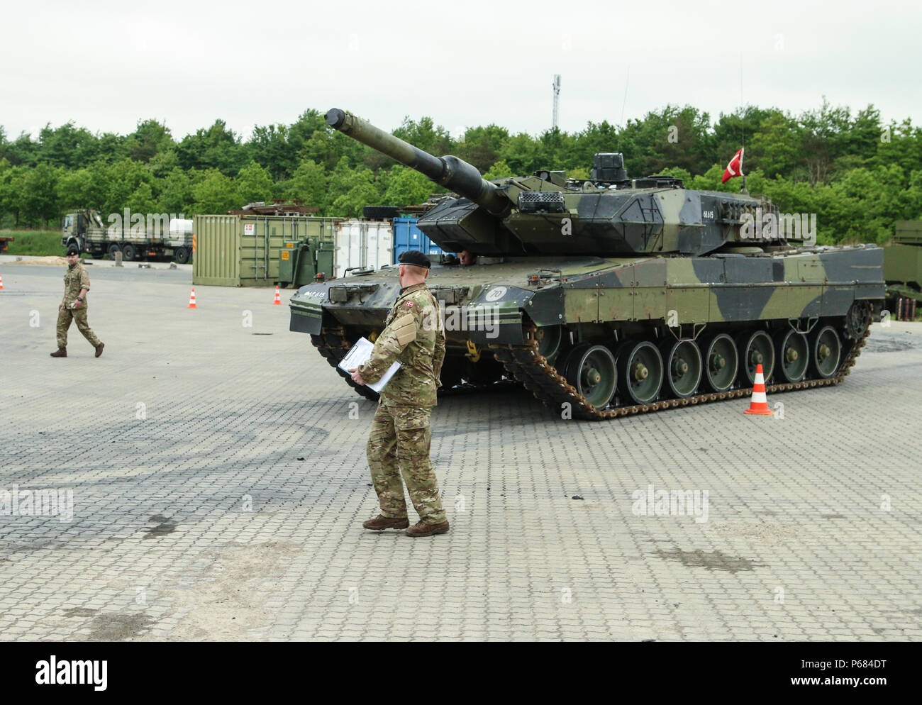 A Royal Danish Army Soldier maneuvers a Leopard 2 A5 Main Battle Tank through a course during ...