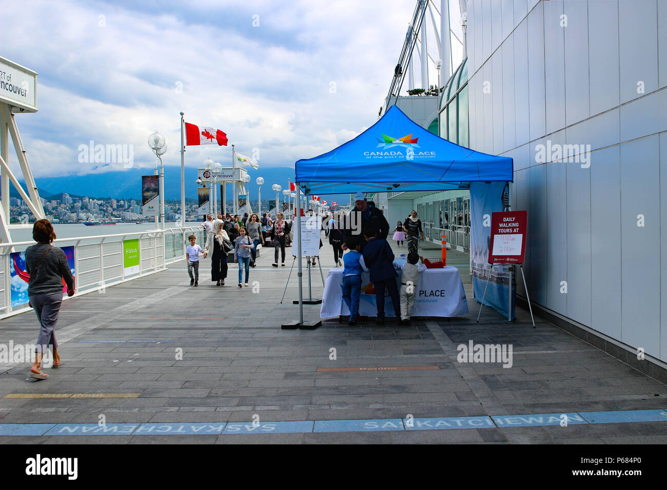 Tourists walking along Canada place destination in Vancouver. Canada ...