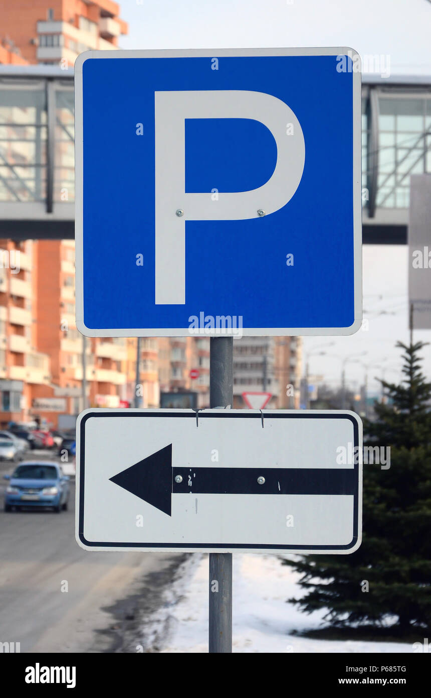 Parking left. Traffic sign with the letter P and the arrows to the left ...