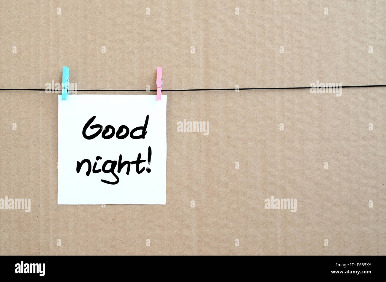 Good night! Note is written on a white sticker that hangs with a ...