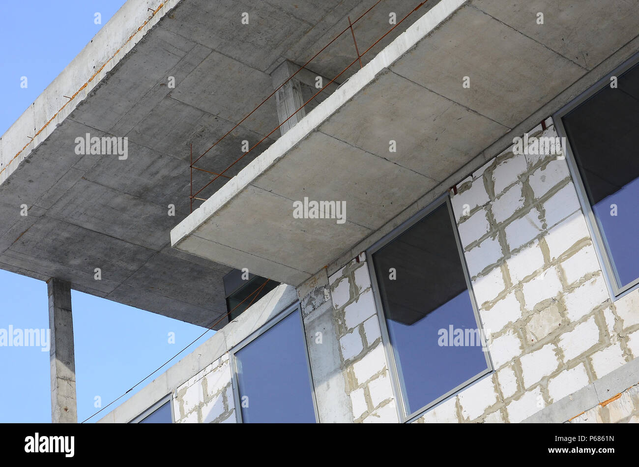 Fragment of an unfinished structure of a multi-storey building made of ...