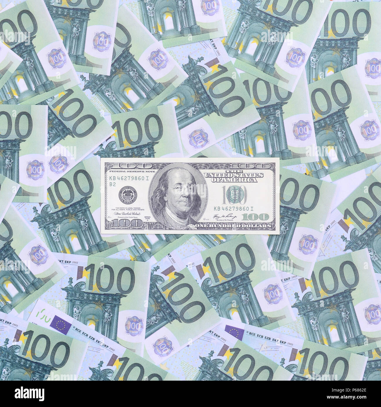 100 dollars bill is lies on a set of green monetary denominations of ...