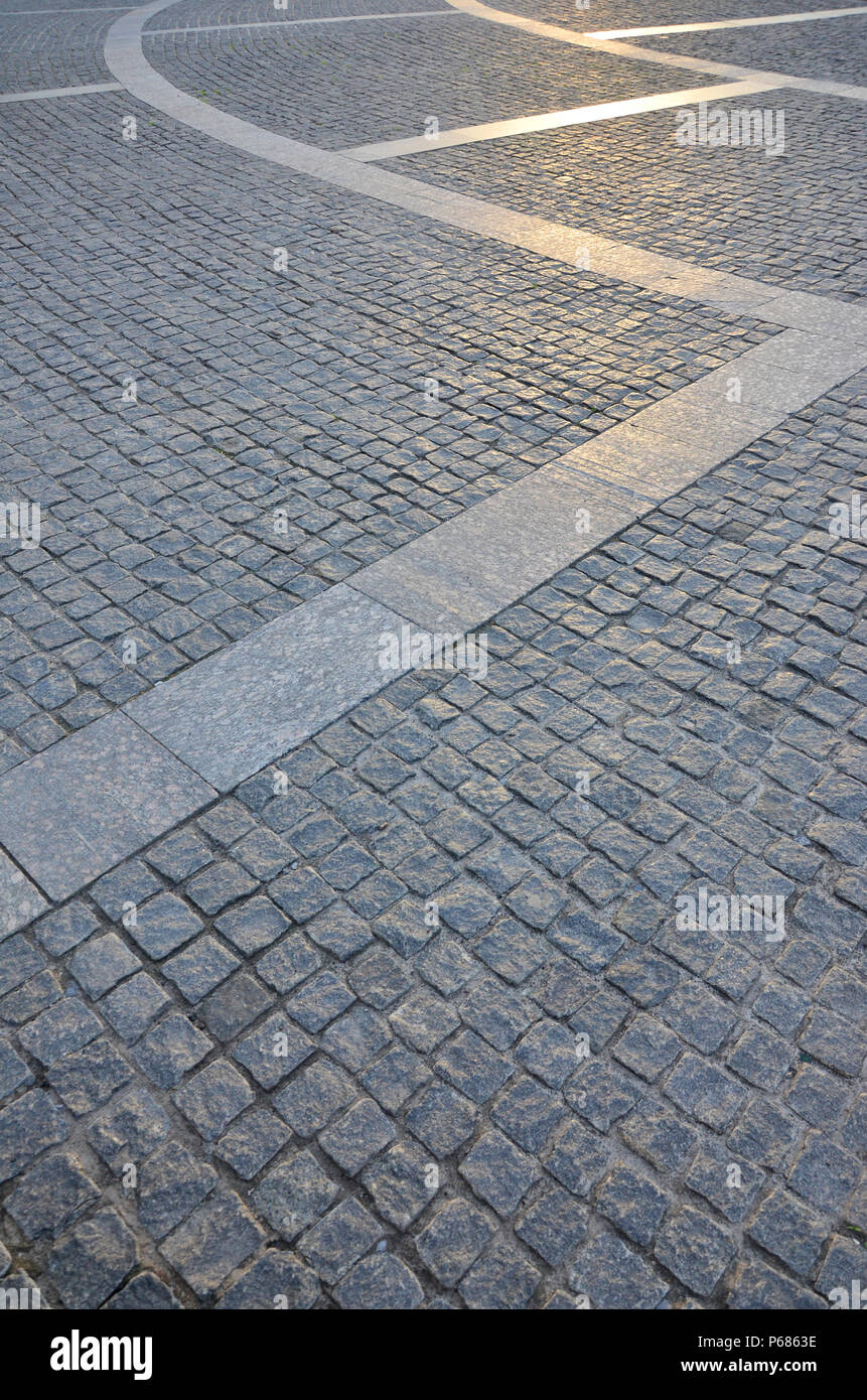 Fragment of the street square, folded out of a gray square paving stone ...
