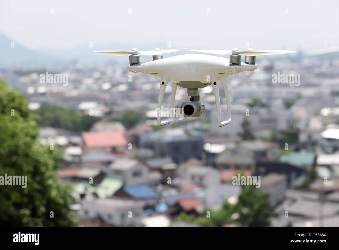 Drone flying over city hi-res stock photography and images - Alamy