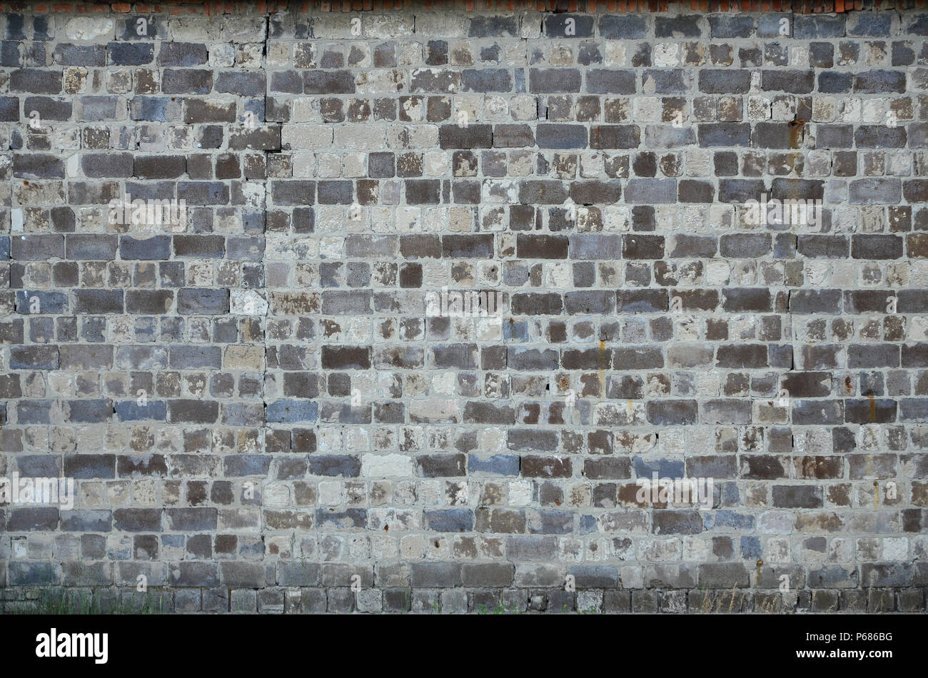 The texture of the warehouse wall from a variety of rough stones of ...