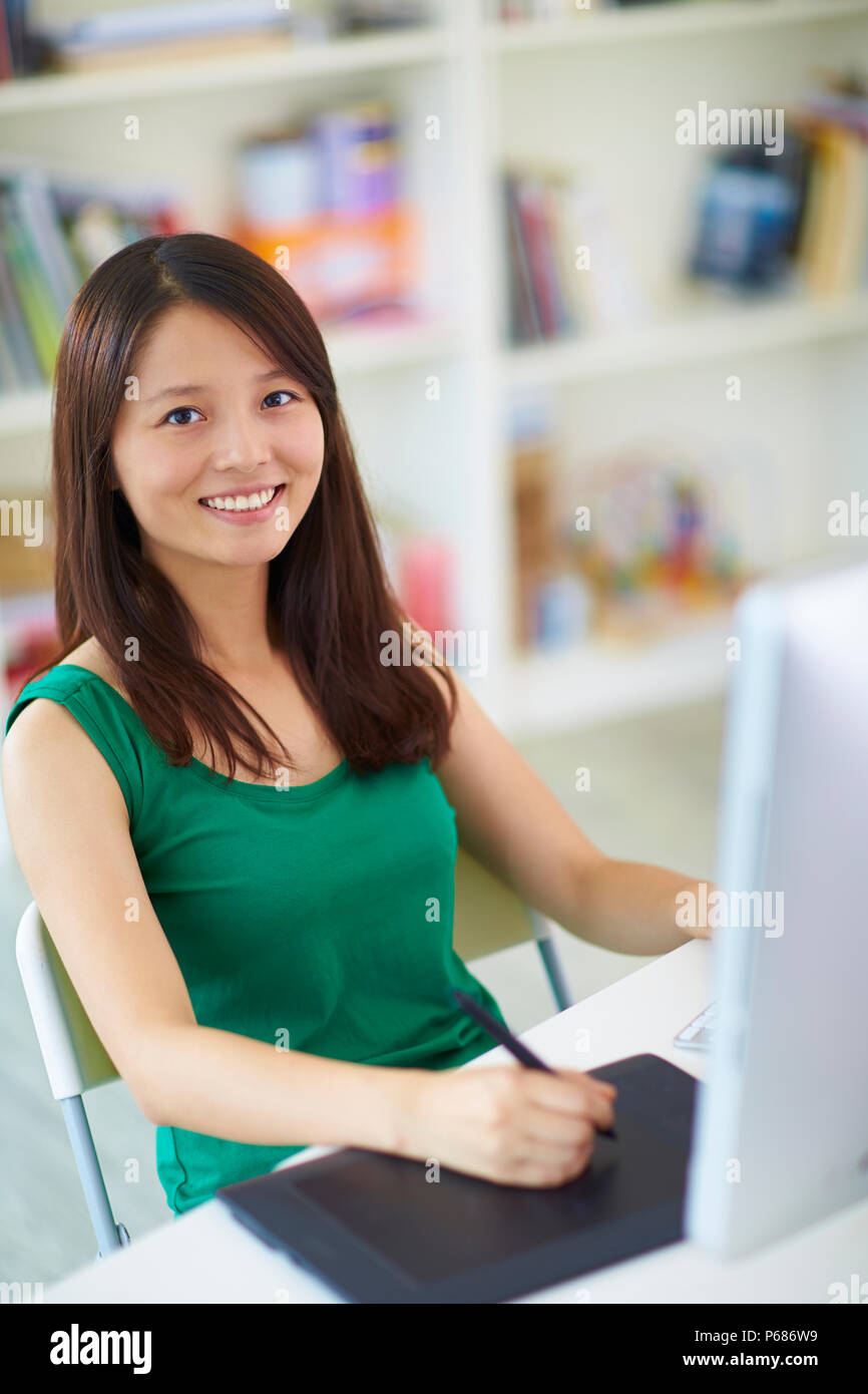 One Young Chinese Woman Working in the Home office with Computer Stock ...