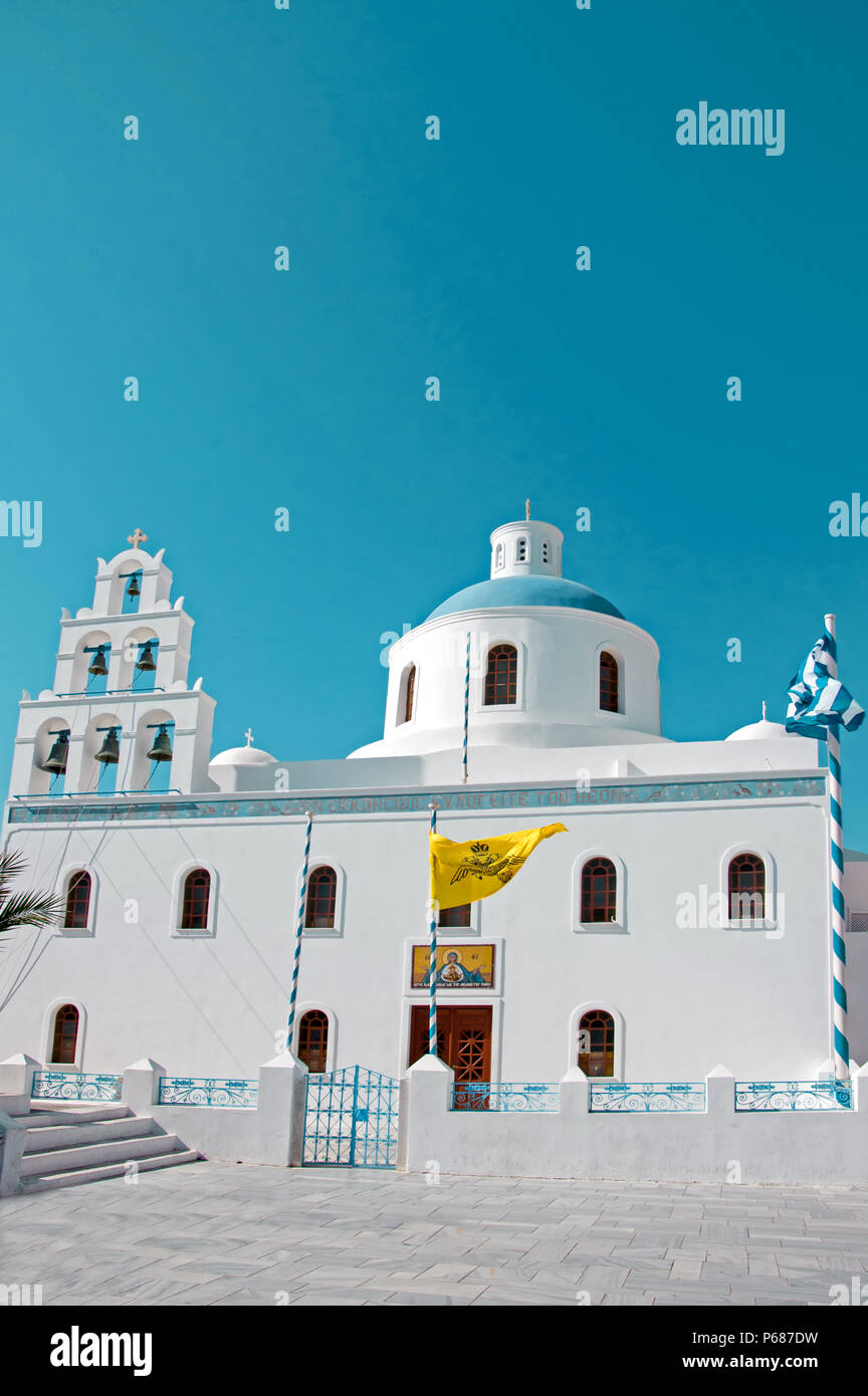 White traditional christian church on the background of blue sky in Oia ...